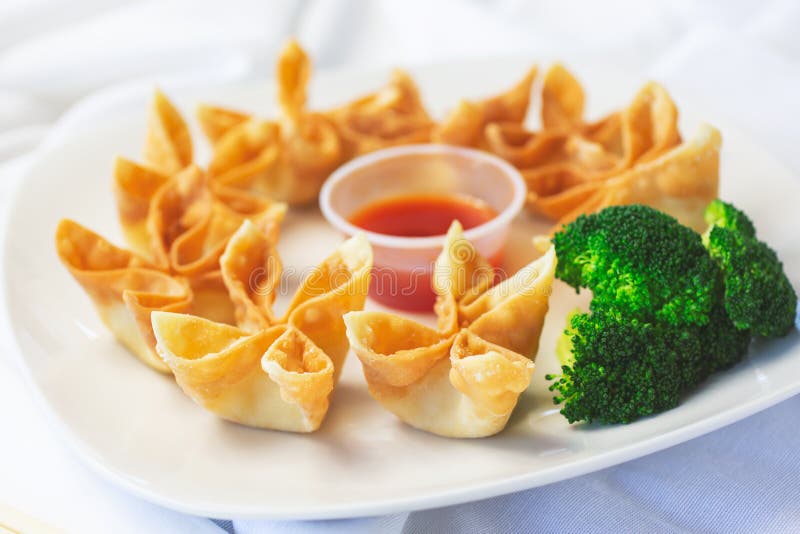 Cream cheese wontons plate stock photo. Image of leaves - 239060306