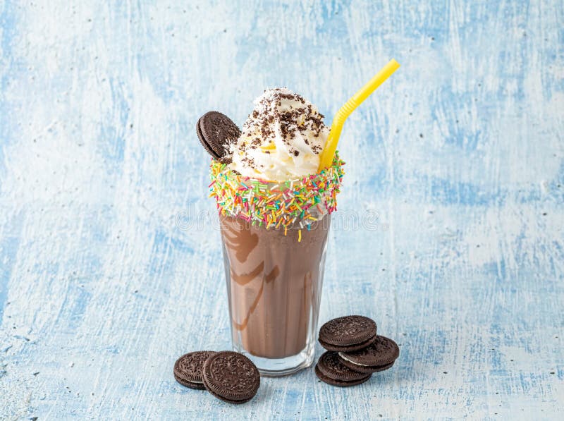Cream and Chocolate Milkshake on Blue Background Stock Image - Image of ...