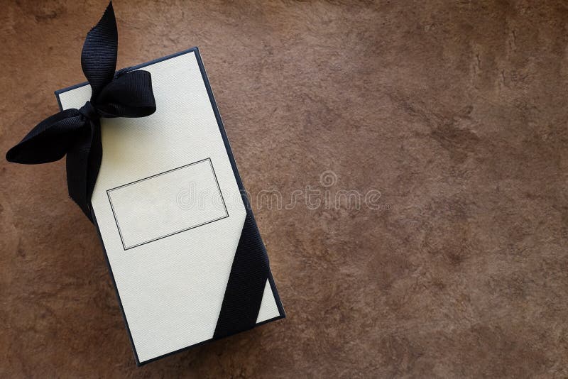 Cream Colored Rectangular Box with Black Ribbon Stock Photo - Image of ...