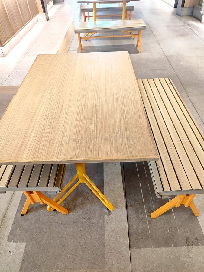 Cream Colored Wooden Tables and Benches in a Restaurant. Stock Photo ...