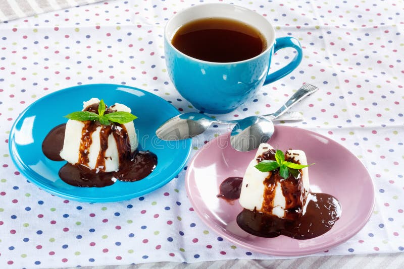Cream Pudding with Chocolate Sauce, Mint and Cup of Tea on Multi Stock ...