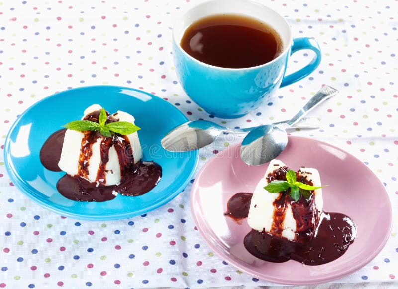 Cream Pudding with Chocolate Sauce, Mint Cup of Tea on Multicolored ...