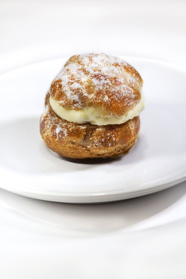 Cream puff on a plate stock image. Image of cuisine, appetizing - 74738509