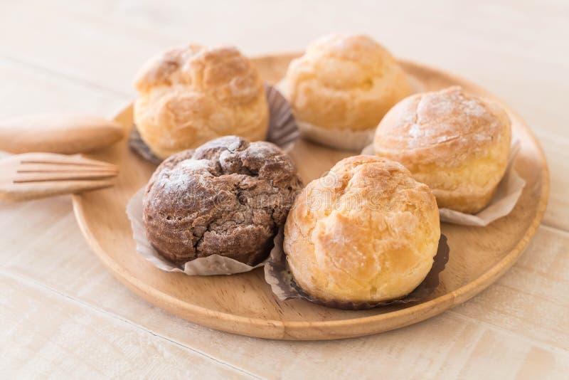 Cream puff on plate stock photo. Image of puff, delicious - 93714852