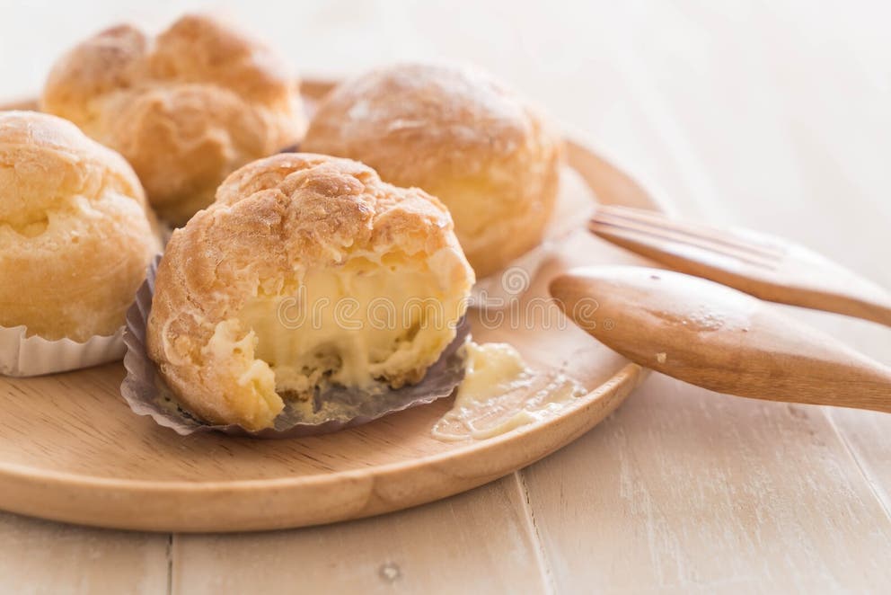 Cream puff on plate stock image. Image of filled, dessert - 94650741