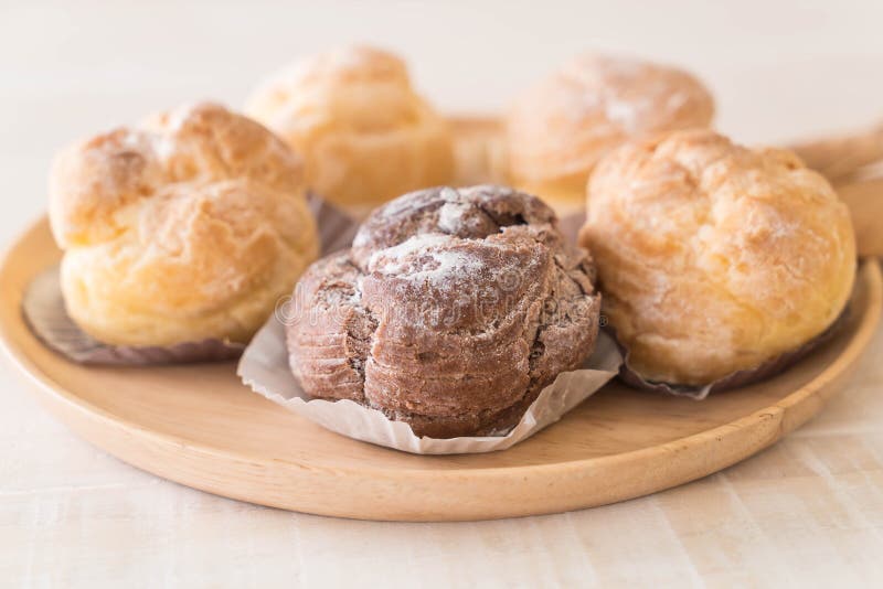 Cream puff on plate stock image. Image of fresh, profiterole - 94651933