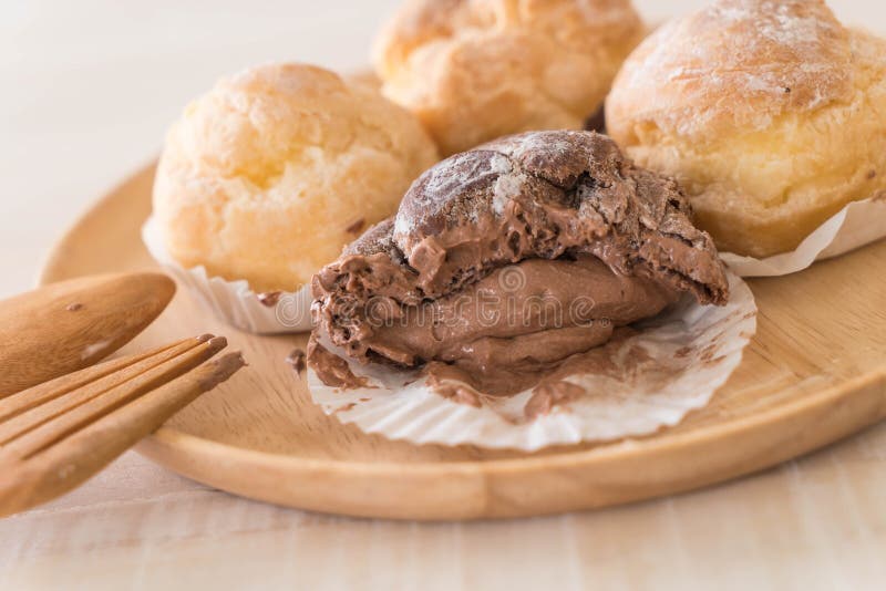 Cream puff on plate stock photo. Image of creampuff, dessert - 94853994