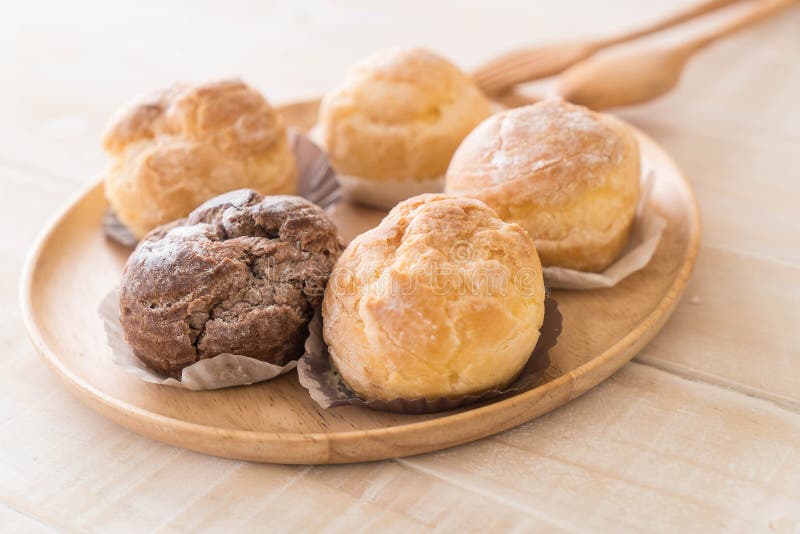 Cream puff on plate stock photo. Image of cream, snack - 95567324
