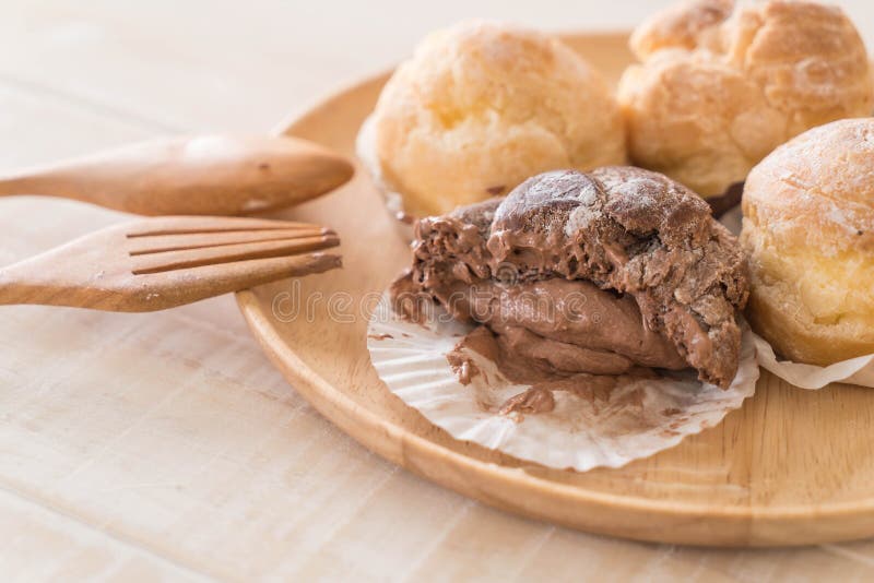 Cream puff on plate stock photo. Image of puffs, snack - 96913238