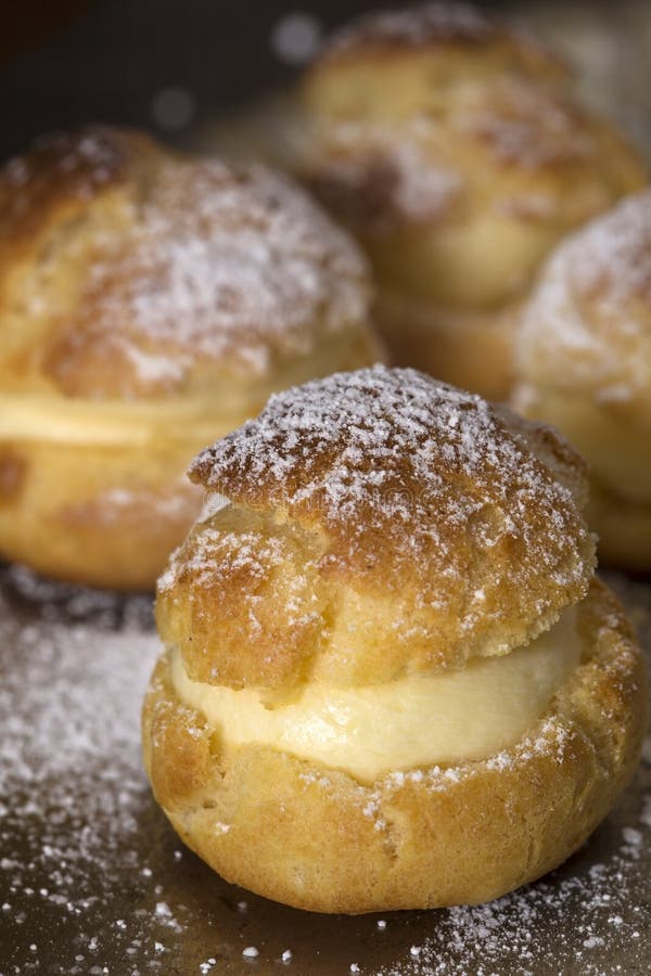 Cream puffs stock image. Image of frosty, baking, filled - 146941481