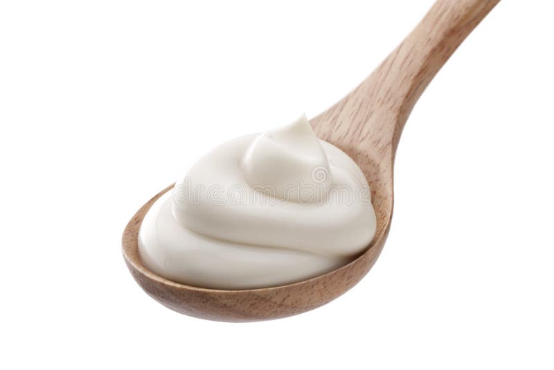 Cream in spoon isolated stock photo. Image of twirl, foam - 43706650