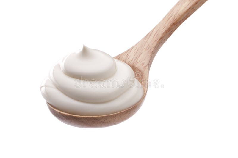 Cream in spoon isolated stock photo. Image of twirl, foam - 43706650