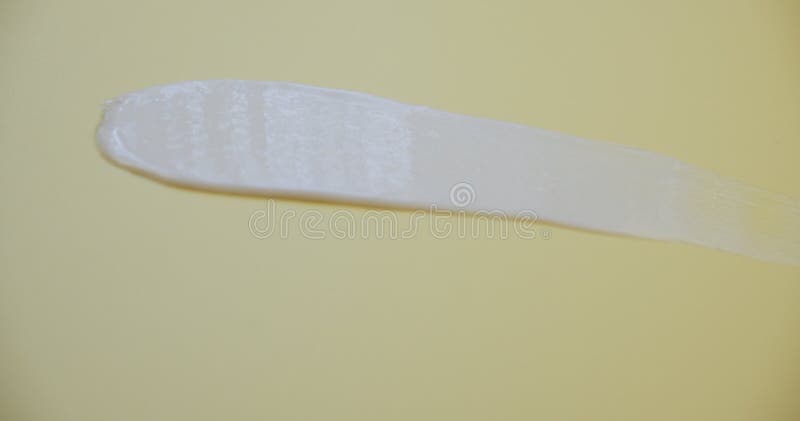 Cream Texture. Smear of White Hand Cream on Yellow Background Stock ...