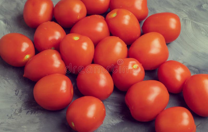 Red Tomatoes of Elongated Shape are Lying on a Wooden Table Stock Image ...