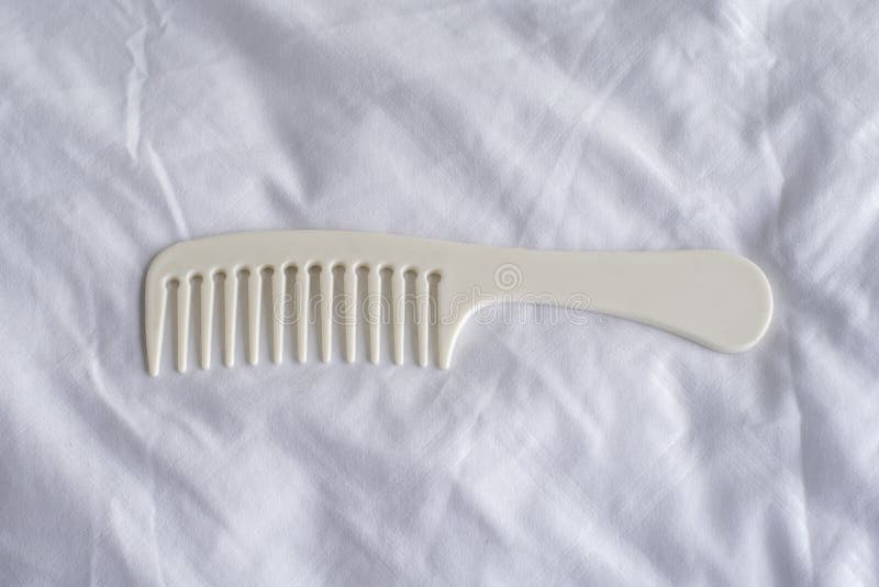 Cream White Comb on White Fabric Stock Photo - Image of elegant ...