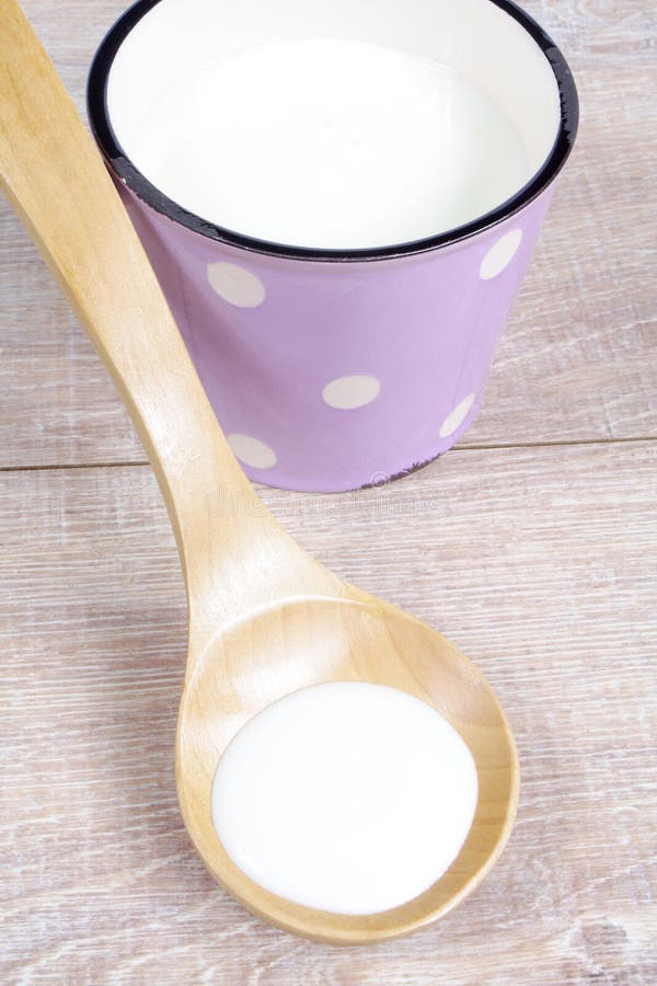 Cream in wooden spoon stock photo. Image of ingredient - 29012444