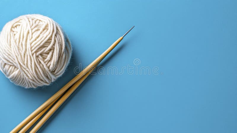 Cream Yarn and Wooden Knitting Needles on Blue Background Stock Image ...
