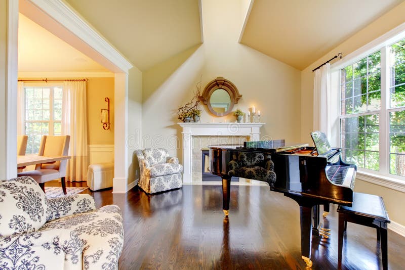 Cream Yellow Living Room with Piano and Fireplace Stock Image - Image ...