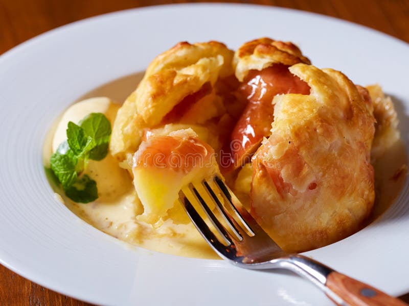 Creamy Bread with Sugar and Mint Leaf on White Platter Stock Photo ...