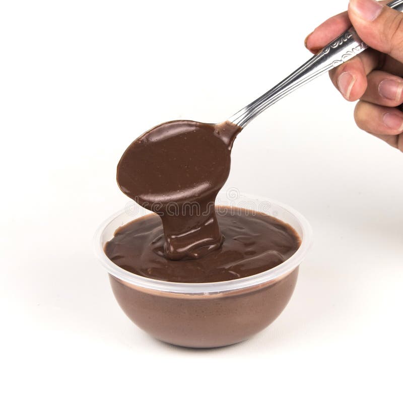 Creamy Chocolate Pudding is Being Scooped from a Small Plastic ...