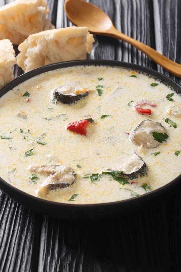 Creamy Fish Soup with Eel, Cheese and Vegetables Close-up in a Bowl ...