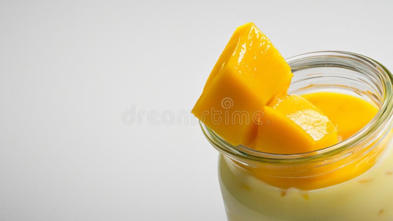 Creamy Mango Sago Dessert Served on a Jar on White Background with Copy ...