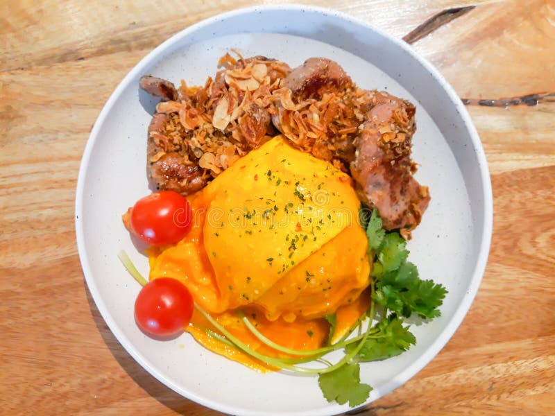 Creamy Omelet on Rice with Garlic Chicken Stock Photo - Image of ...