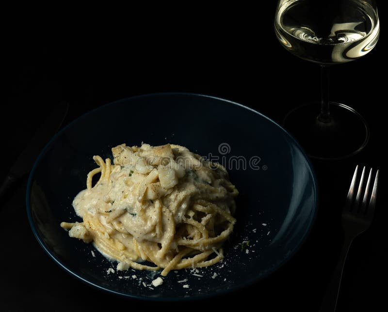 Creamy Pasta Delight with Cheese Topping Stock Photo - Image of wine ...