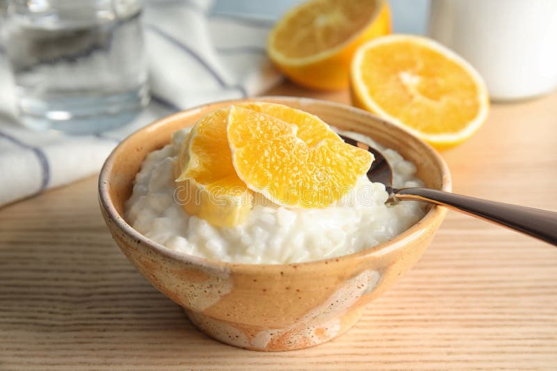 Creamy Rice Pudding with Orange Slices in Bowl Stock Image - Image of ...