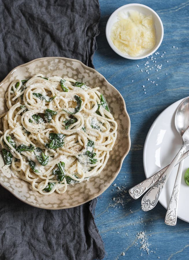 Creamy Spinach Spaghetti on Blue Wooden Table Stock Image - Image of ...