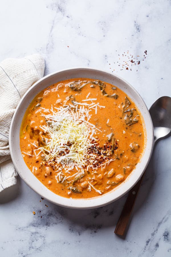 Creamy Tomato Bean Stew with Spinach and Cheese Stock Photo - Image of ...