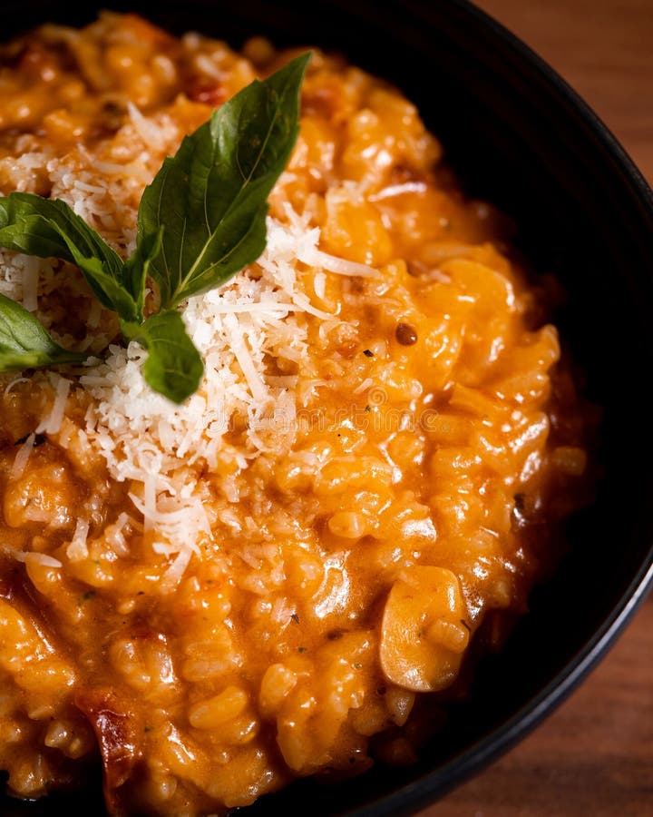 Creamy Tomato Risotto with Parmesan and Basil Stock Photo - Image of ...