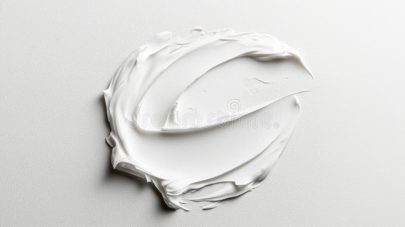 Creamy White Substance Spread Across a Smooth, Light-colored Surface in ...