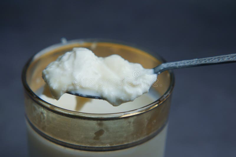 Creamy Yogurt Served in a Glass with a Spoon for Tasting Stock Image ...