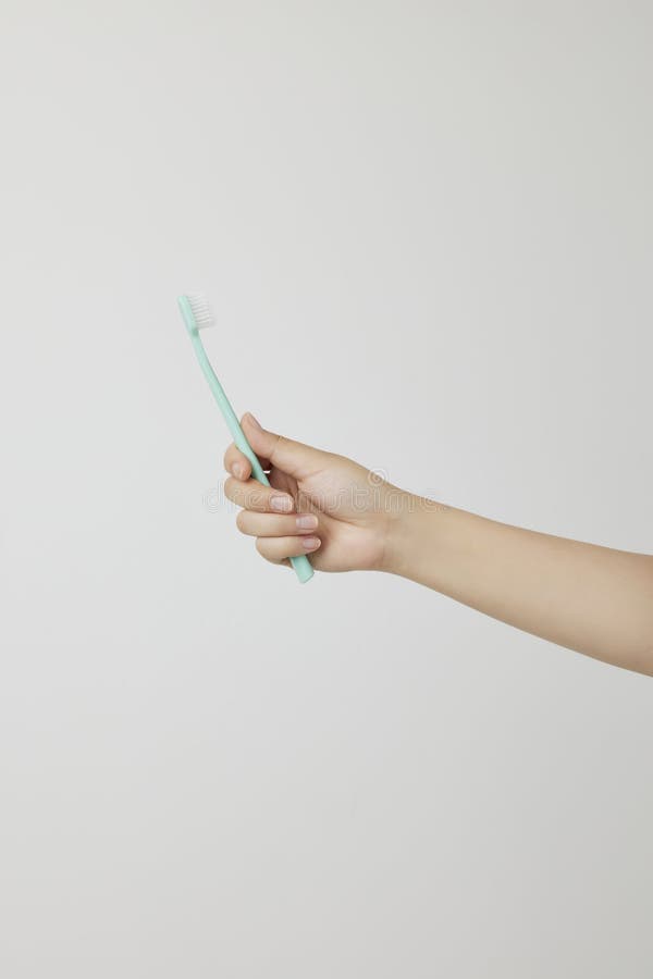 Photo of Using a Toothbrush Stock Photo - Image of pink, directed ...