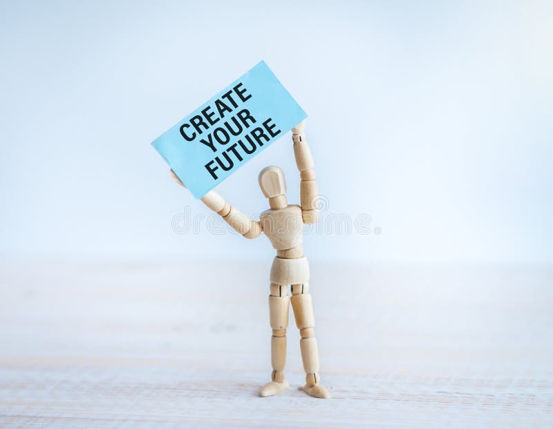 Create Your Future Text on Paper in the Hands of a Wooden Man. Stock ...