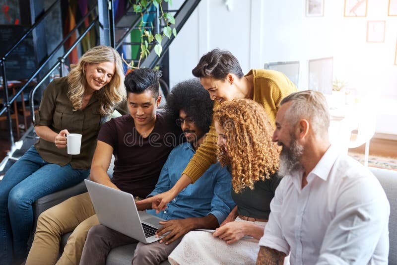 Creating Awesome Designs. a Group of Designers Working Together on a ...