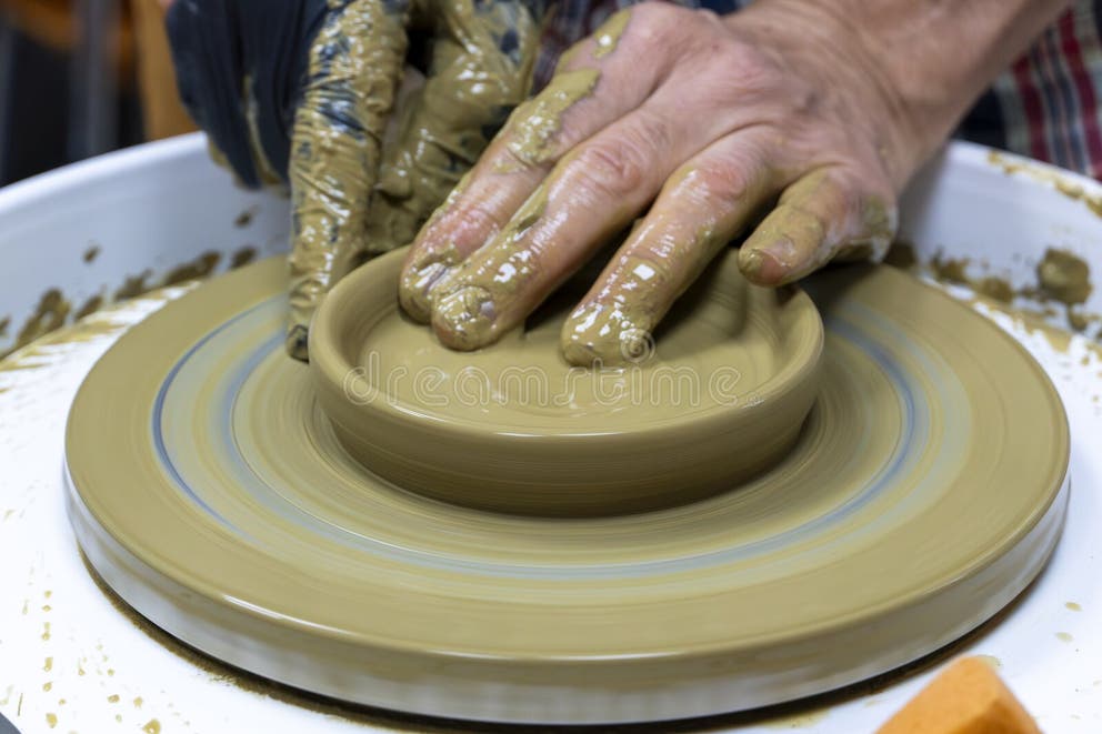 Creating a Ceramic Bowl in a Pottery Class. Wheel Throwing Stock Photo ...
