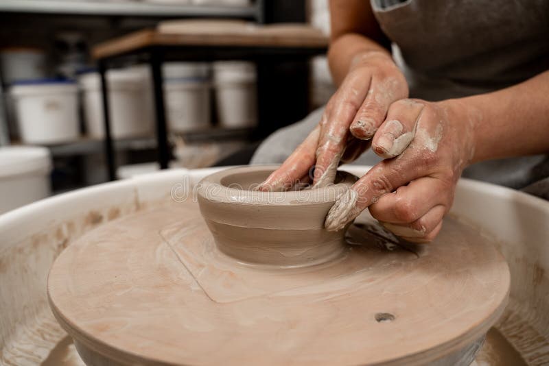 Creating a Ceramic Bowl by Yourself in a Pottery Class. Wheel Throwing ...