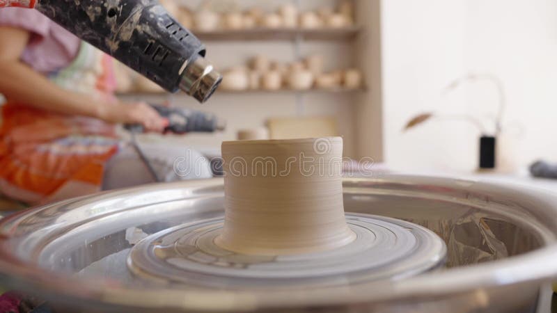 Creating a Custom Ceramic Piece on the Pottery Wheel in a Studio Stock ...