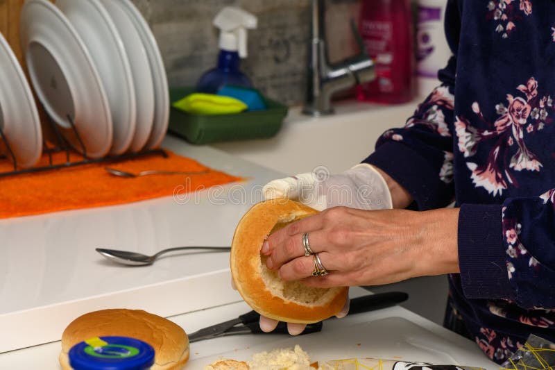 Creating a Delicious Sandwich in a Cozy Kitchen during a Sunny ...