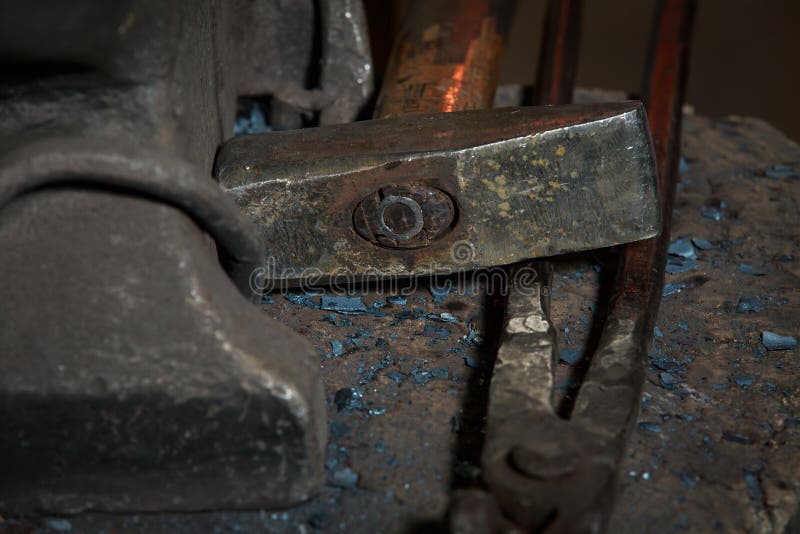 Creating Iron Tools in Blacksmith`s on the Old Plank Wood Table Stock ...