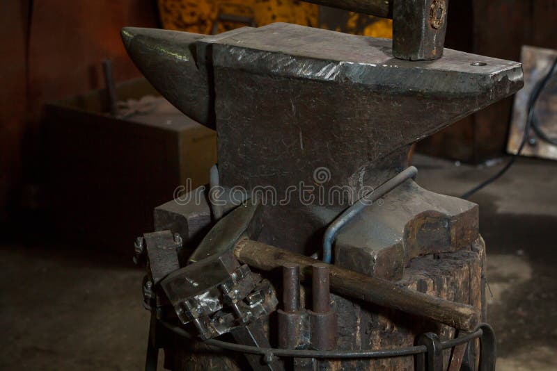 Creating Iron Tools in Blacksmith`s on the Old Plank Wood Table Stock ...