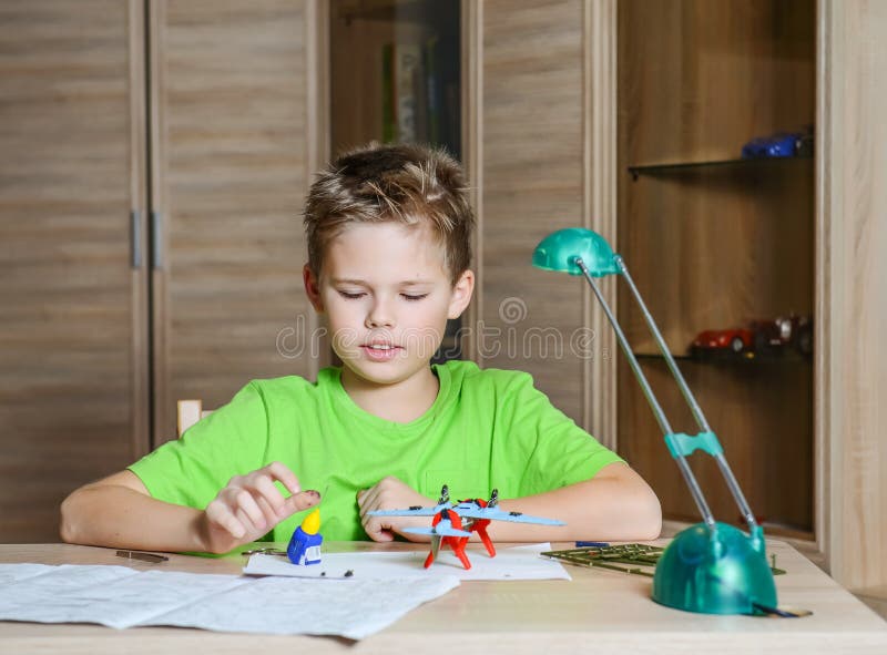 Creating the Model Plane. Happy Boy Making Aircraft Model. Hobby ...