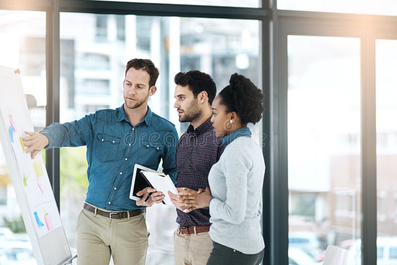 Creating Opportunities Together. Colleagues Having a Discussion Using a ...