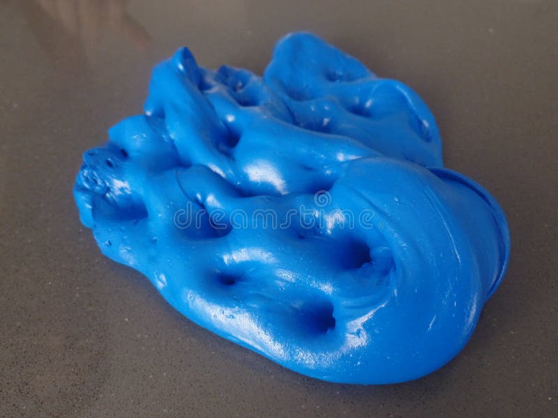 Creating Patterns with Blue Slime Stock Photo - Image of obsession ...