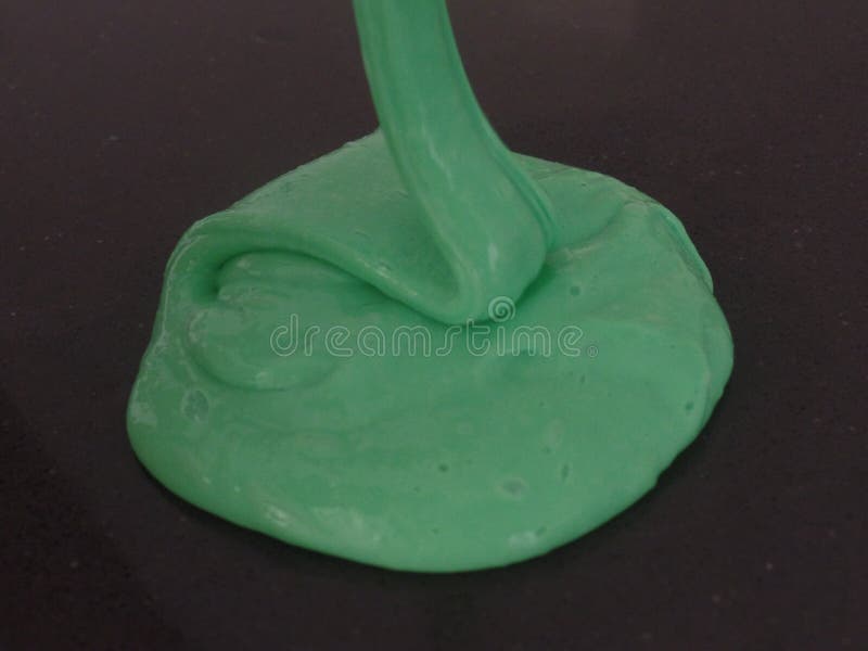 Creating Patterns Out of Bright Green Slime Stock Photo - Image of ...