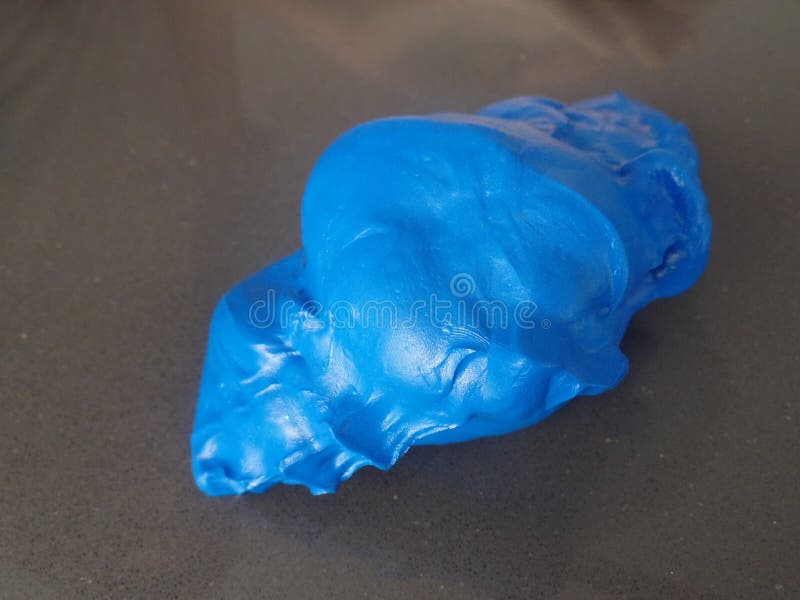 Creating Patterns with Blue Slime Stock Photo - Image of foam, grey ...