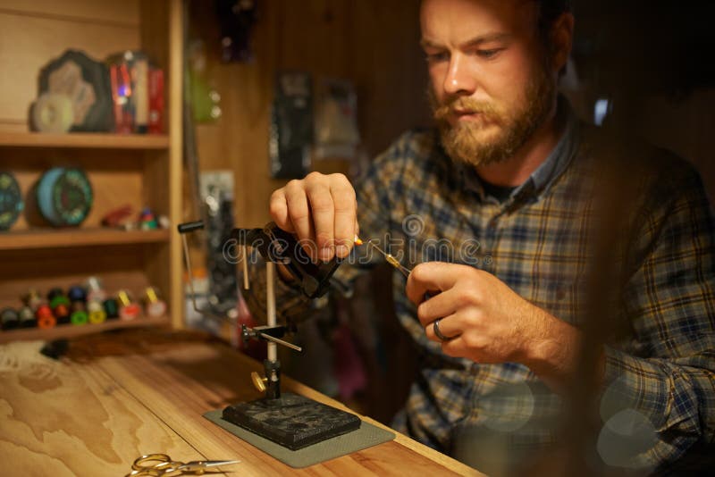 Creating the Perfect Fishing Tackle. Shot of a Man Making Fishing Lures ...