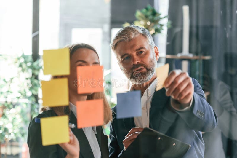 Creating the Plan. Putting Stickers on the Glass Stock Image - Image of ...